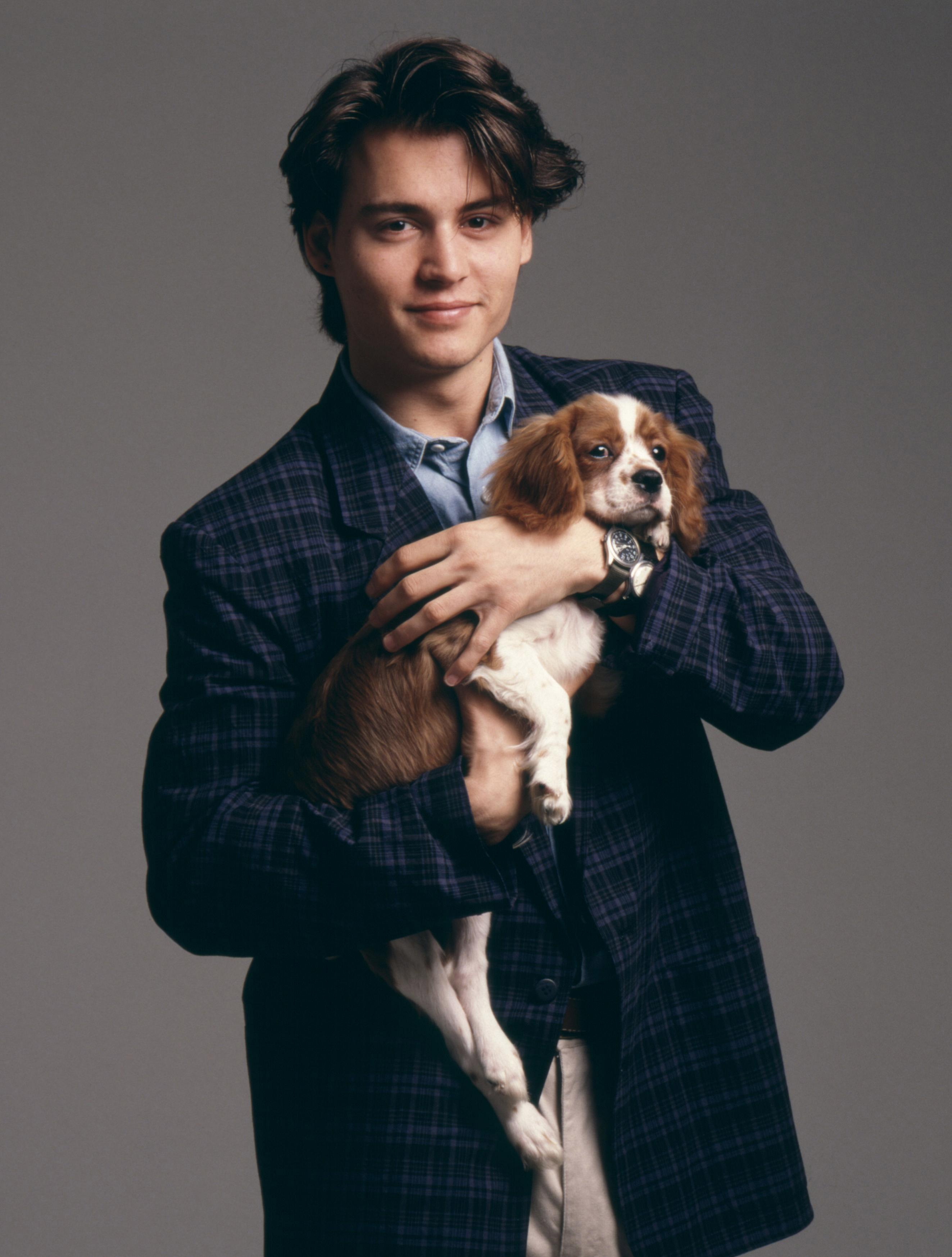 Johnny Depp with puppy - MyConfinedSpace