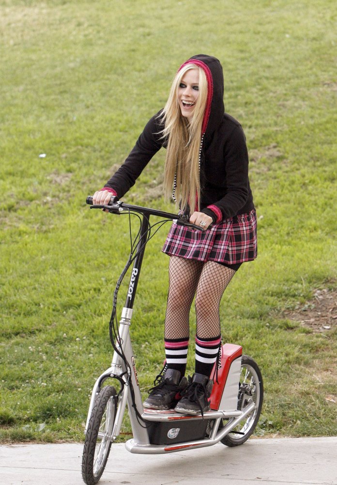 Avril Lavigne on an electric scooter - MyConfinedSpace