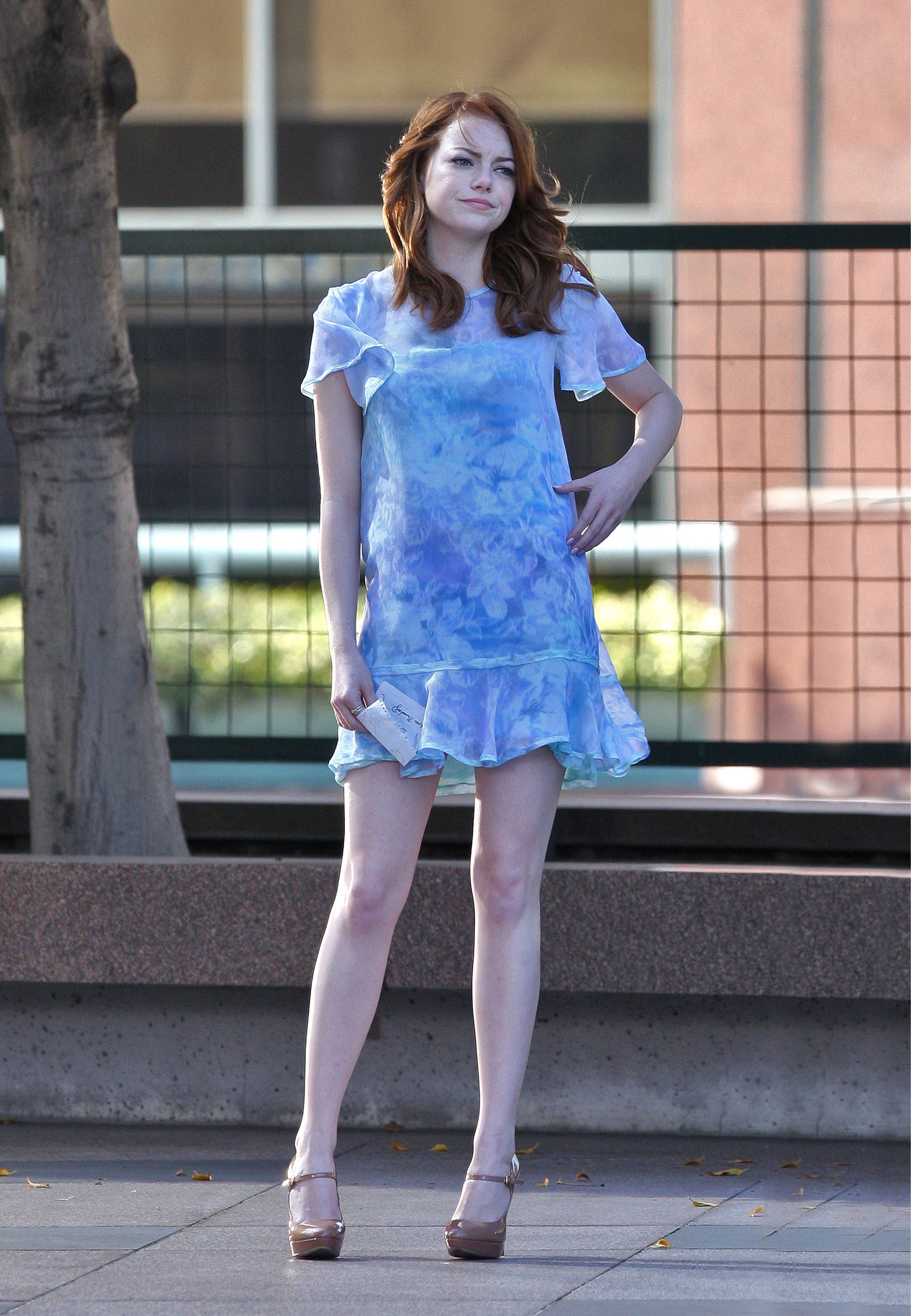 Emma holds her dress down - MyConfinedSpace MyConfinedSpace