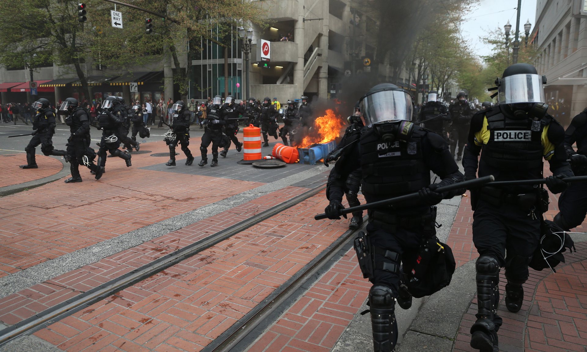 Police disperse people participating in a May Day rally in downtown ...