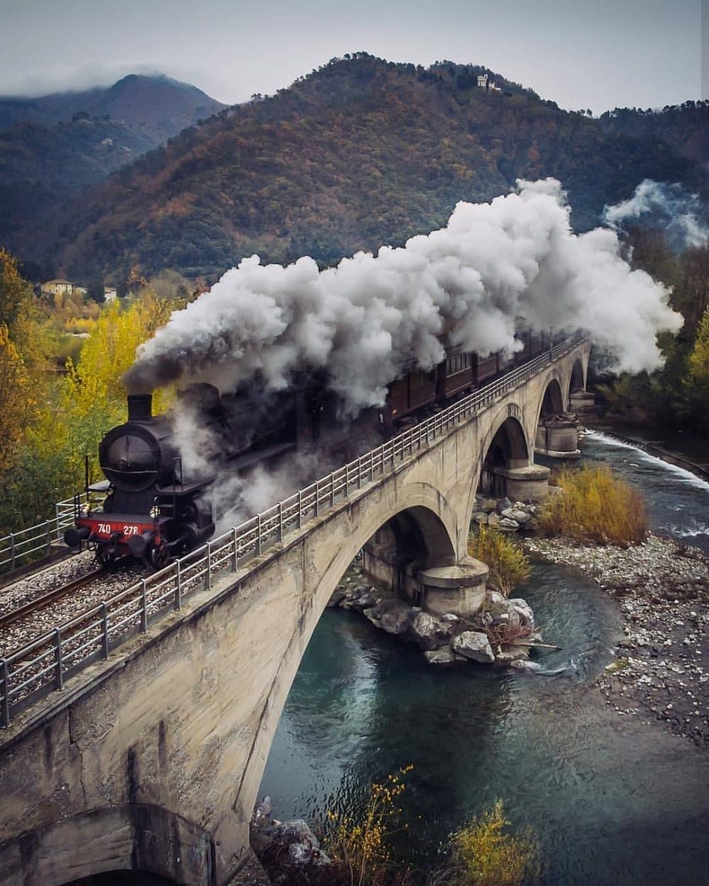 smokey train on bridge - MyConfinedSpace