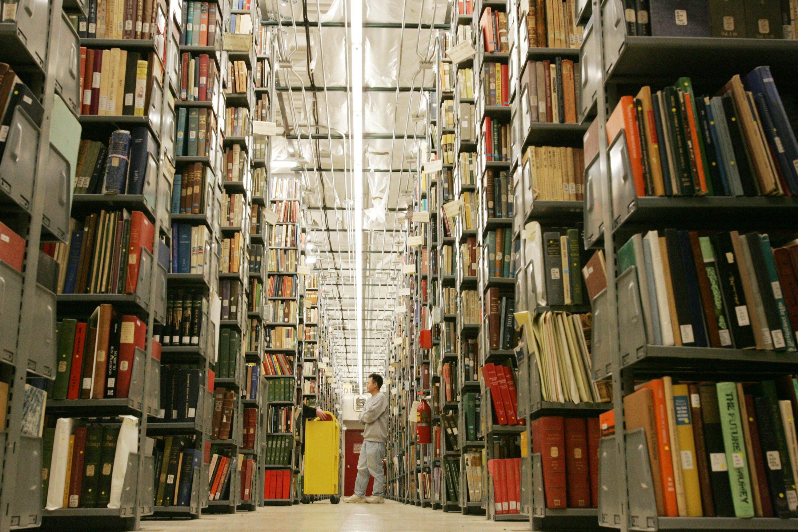 A library staffer at the University of Michigan’s Buhr Shelving ...