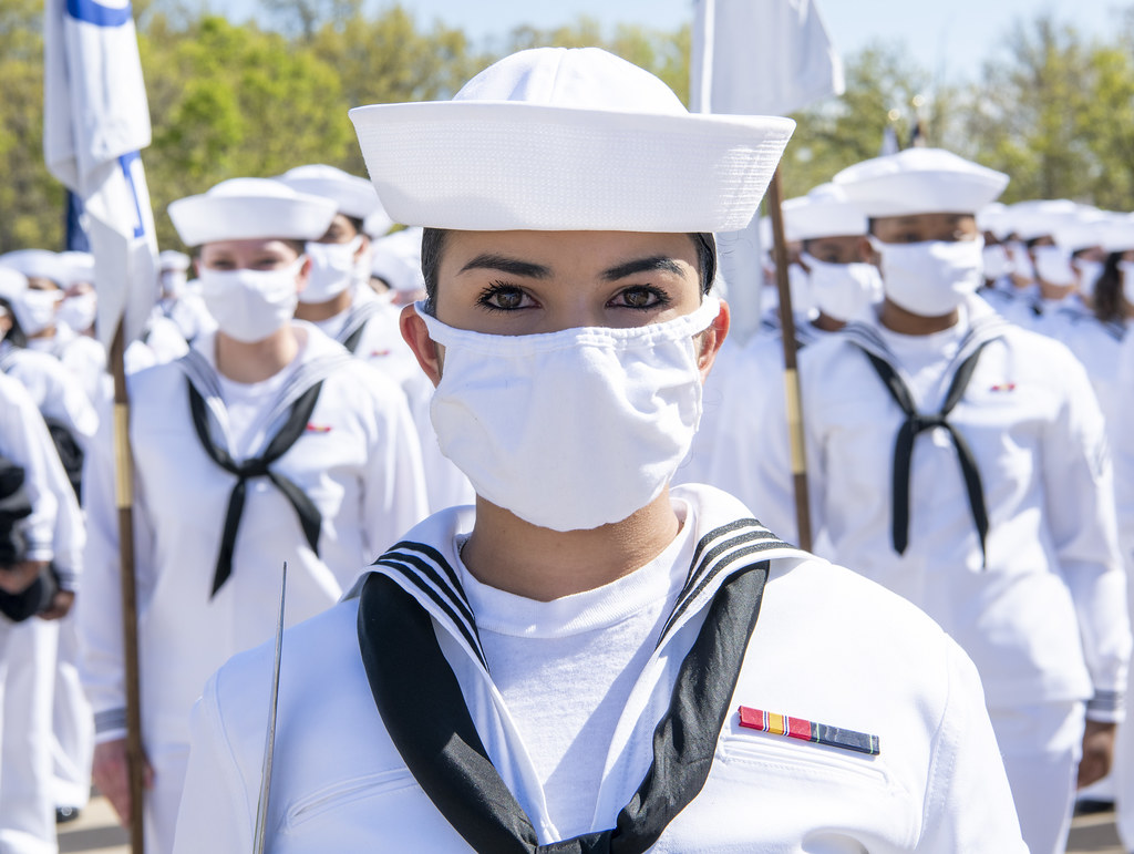 A recruit chief petty officer stands at the lead of her formation ...