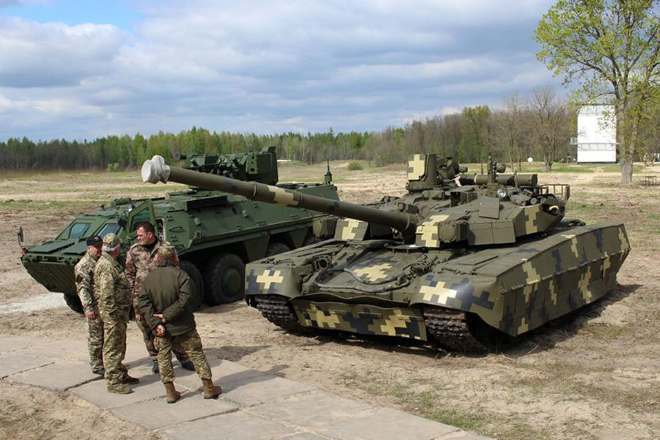 Ukrainian t-84 Oplot in digital camouflage next to a BTR-4 ...
