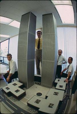 Architect Minoru Yamasaki posing with a model of the World Trade Center ...