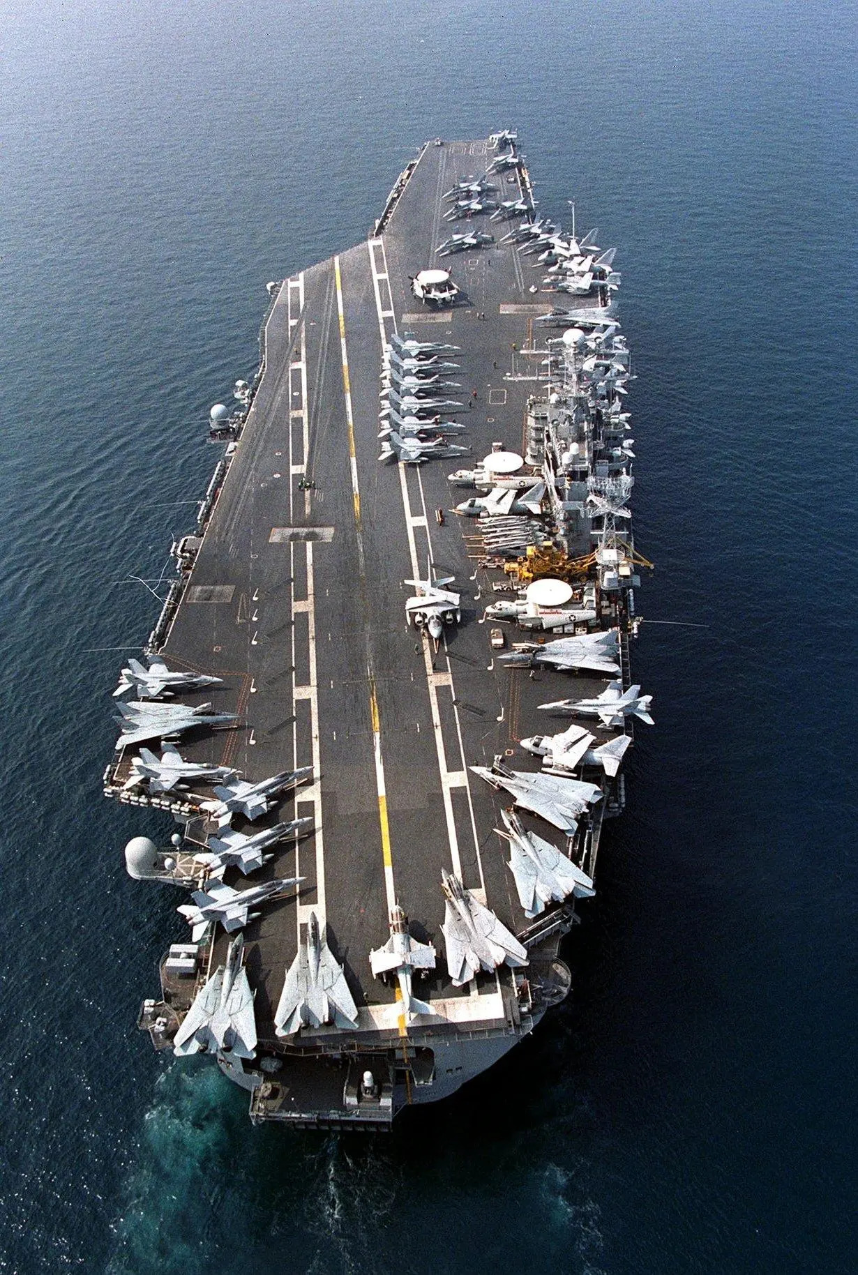 Aerial view of the carrier USS Nimitz with Tomcat parking on her flight ...