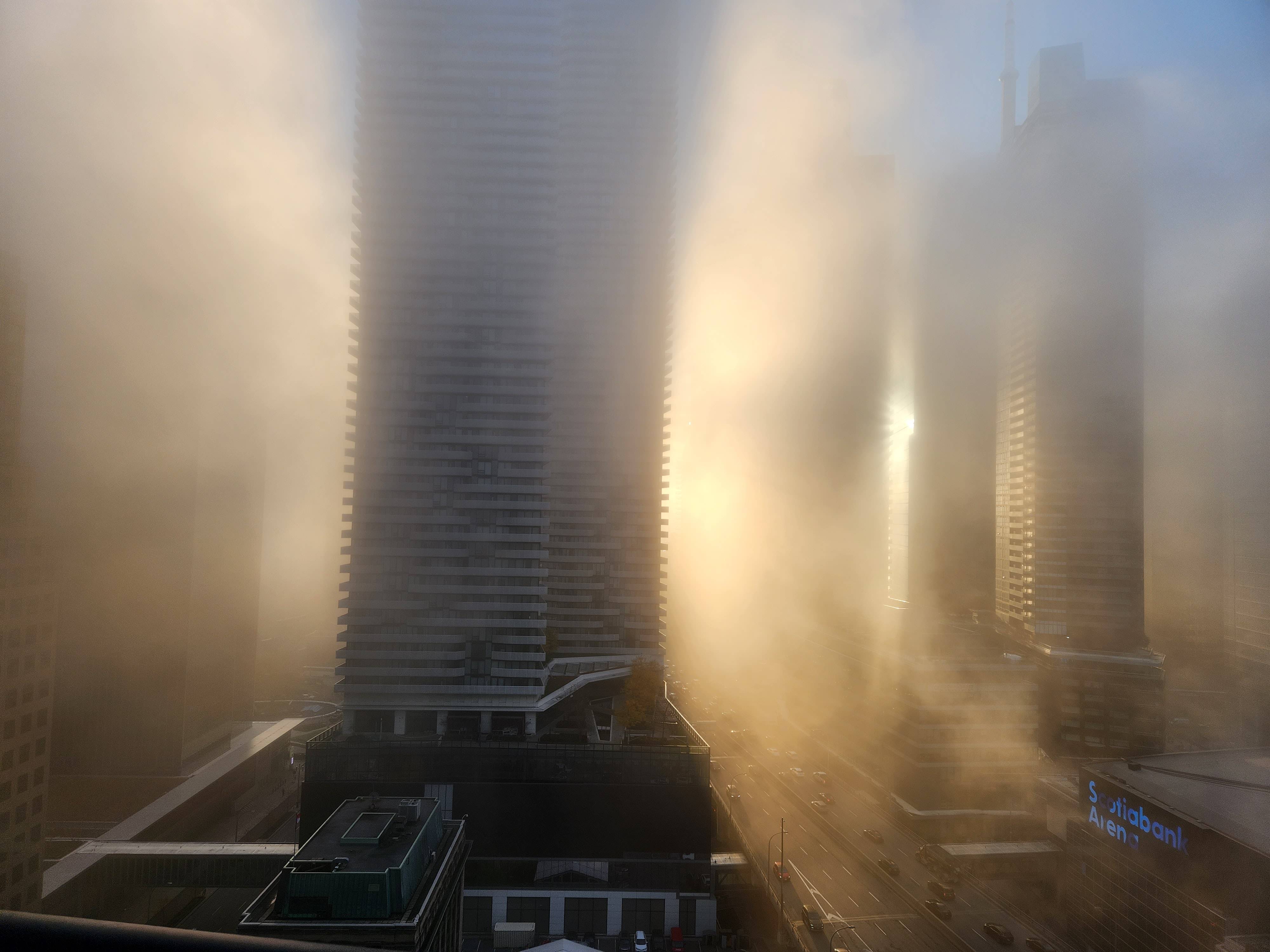 Toronto condo building shrouded in fog at sunset - MyConfinedSpace