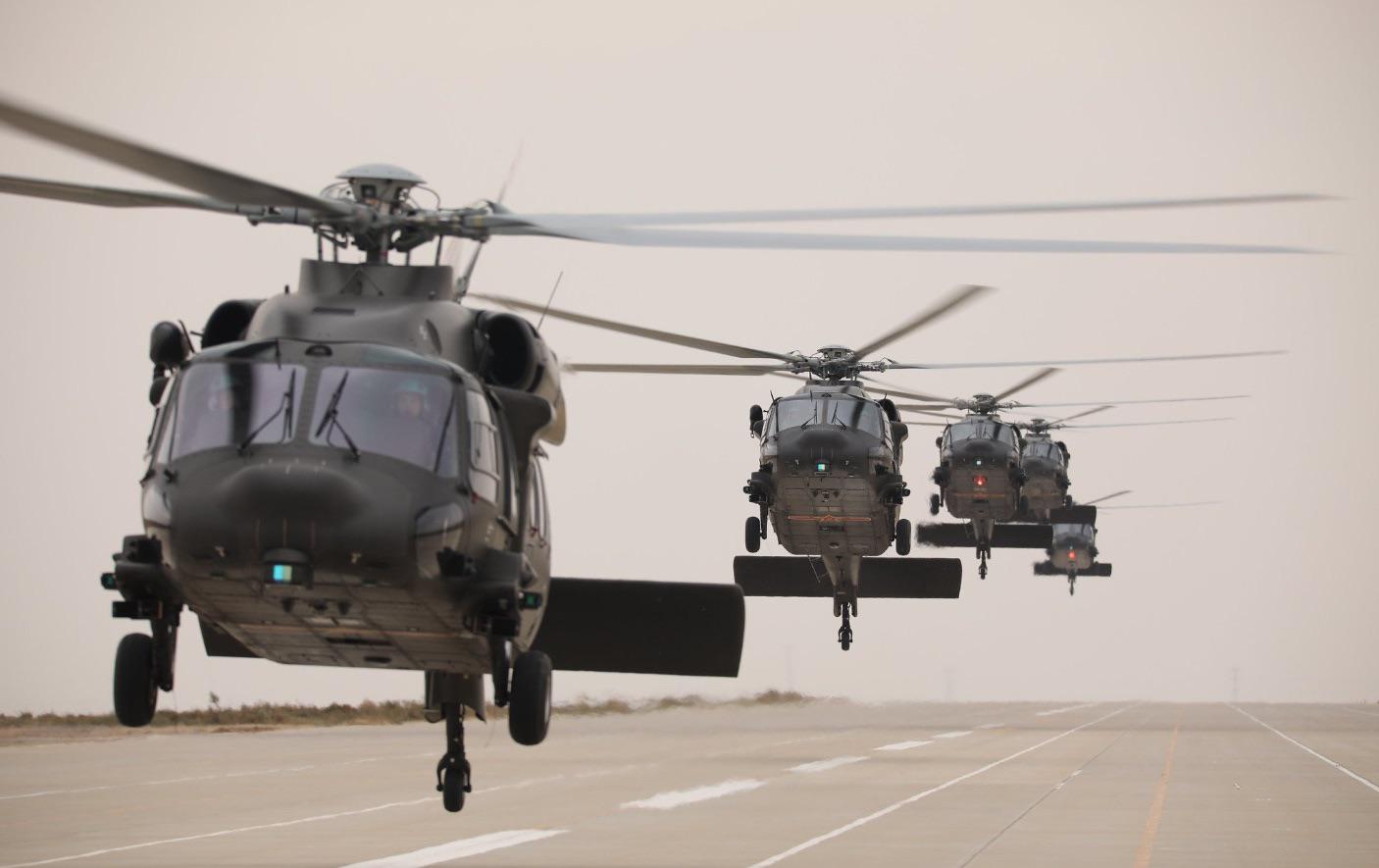 Chinese Harbin Z-20 helicopters participating in an air assault ...