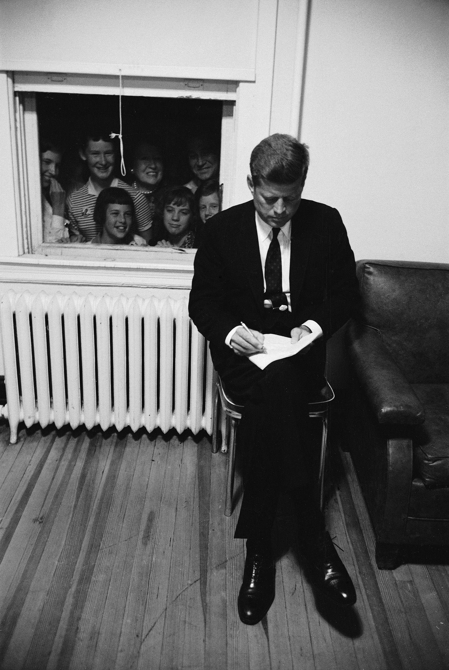 JFK checking over his speech during the Presidential campaign, 1960 ...